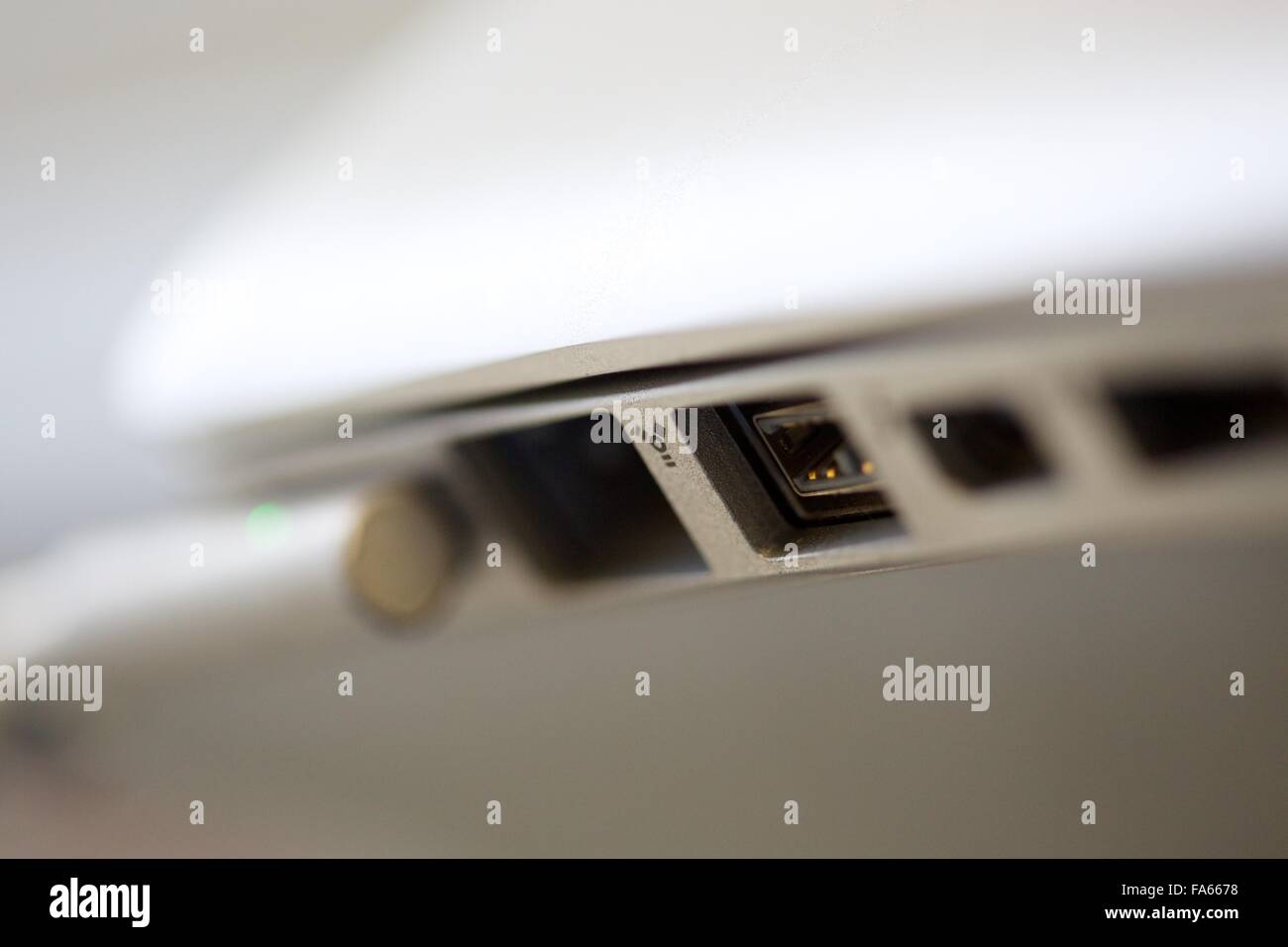 close up images of a macbook socket section showing ethernet and ...