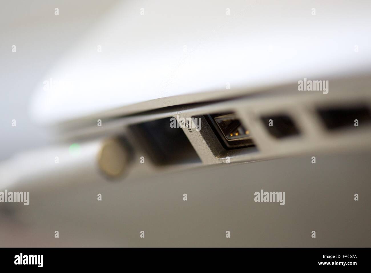 close up images of a macbook socket section showing ethernet and ...