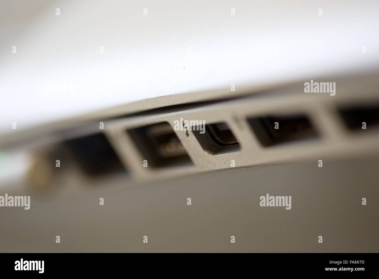close up images of a macbook socket section showing ethernet and ...