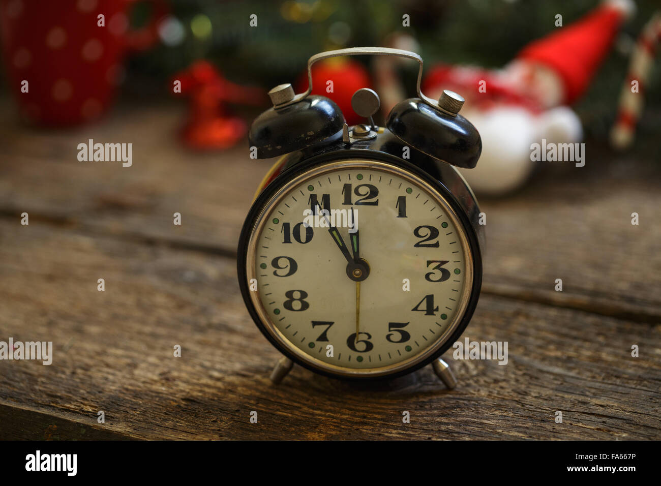 Vintage alarm clock on christmas background Stock Photo - Alamy
