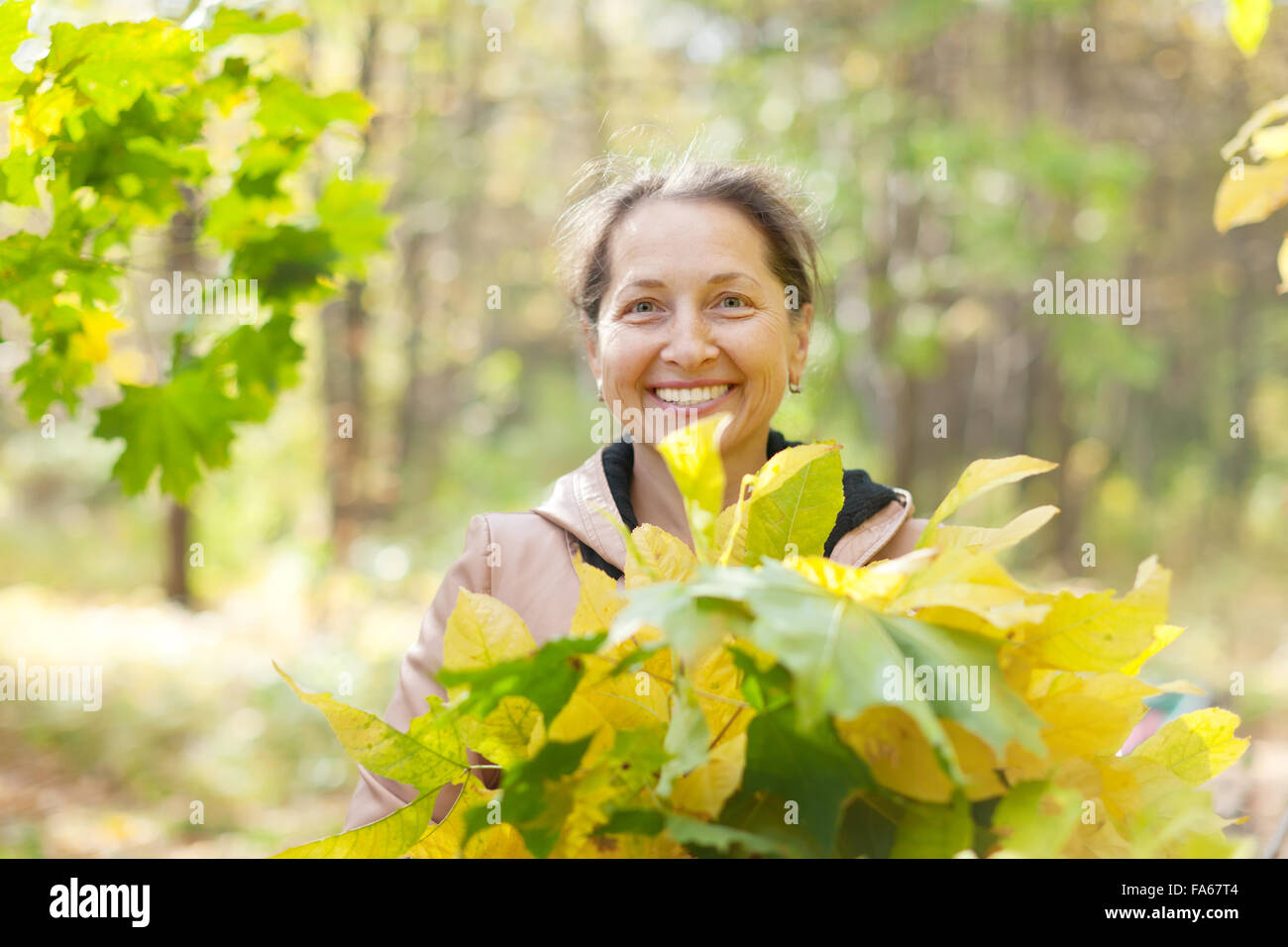 Outdoor portrait of mature woman in autumn Stock Photo - Alamy