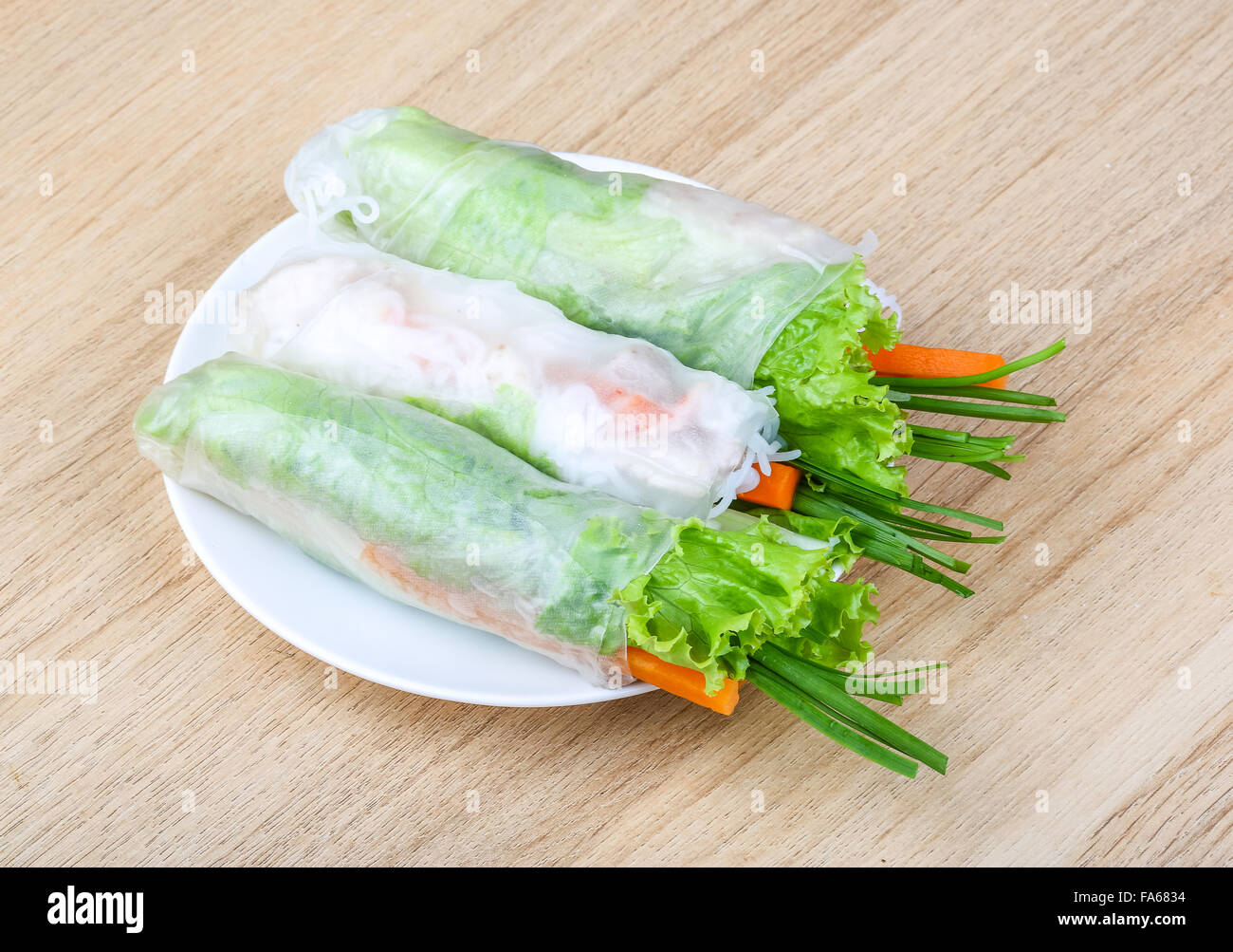 Asian traditional spring rolls on the wood background Stock Photo - Alamy