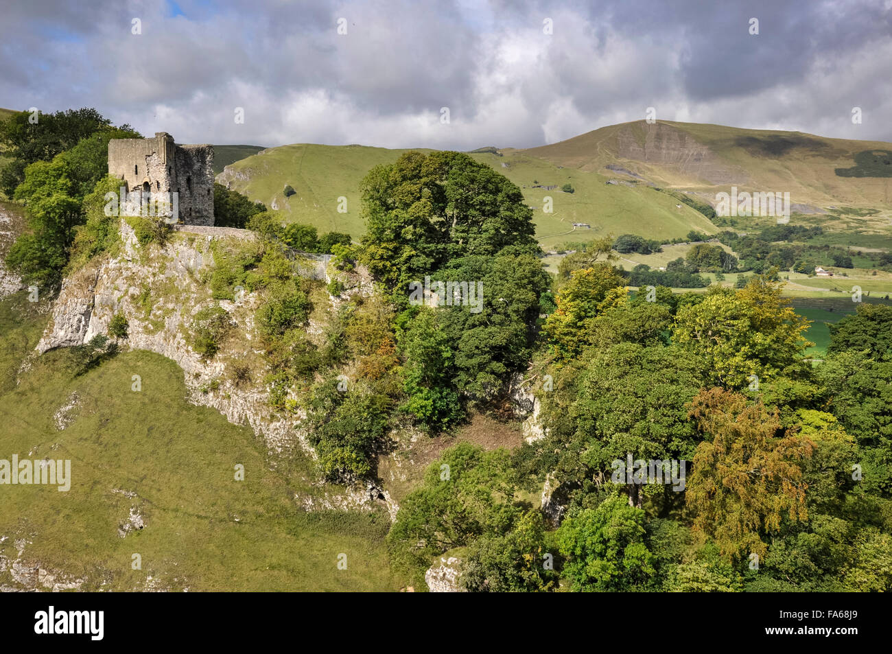 Peveril castle sitting on a limestone crag above Cave Dale in Castleton ...