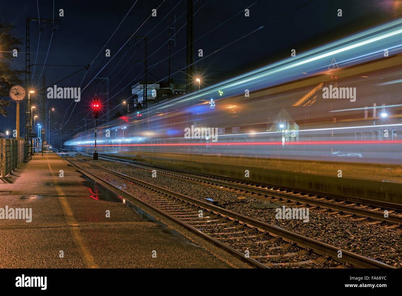 Light trails of a train going through station, Germany Stock Photo - Alamy