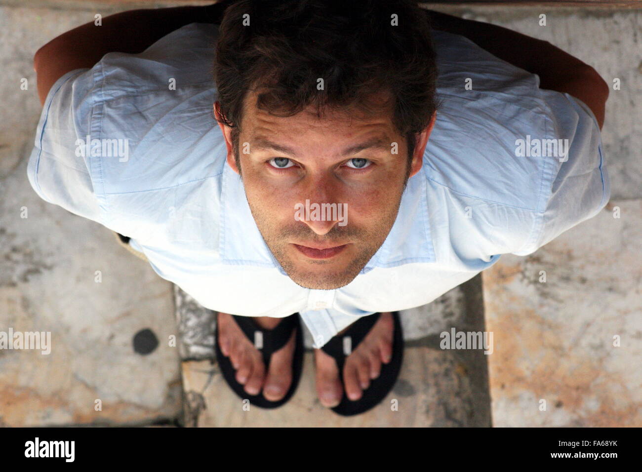 Overhead view of a man looking up Stock Photo - Alamy