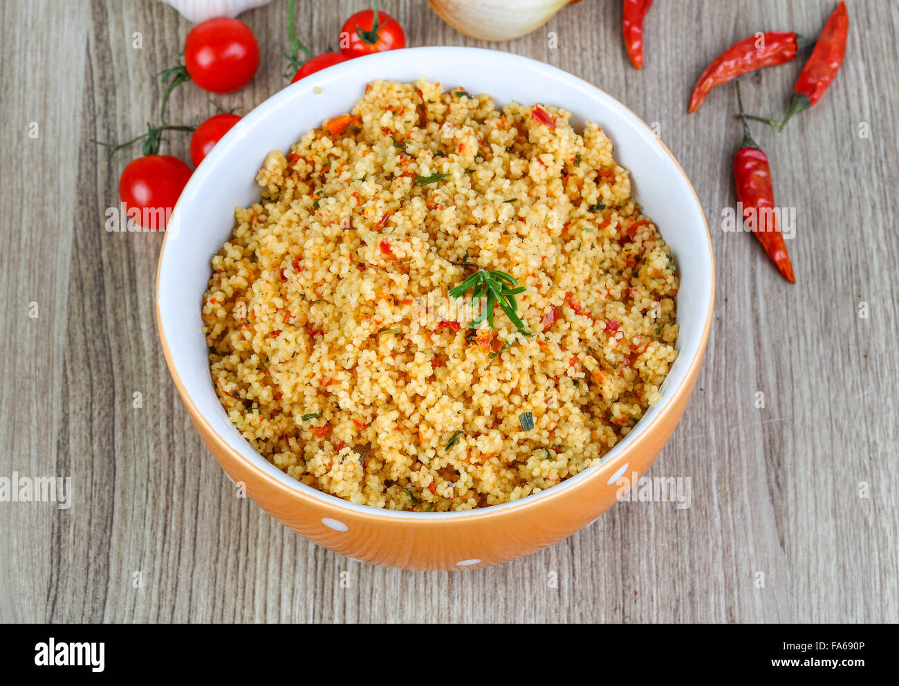Arabic traditional cuisine - Couscous with tomato and green onion Stock ...