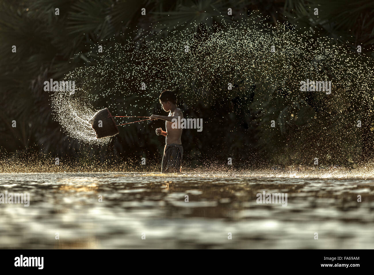 Boy holding bucket in river hi-res stock photography and images - Alamy