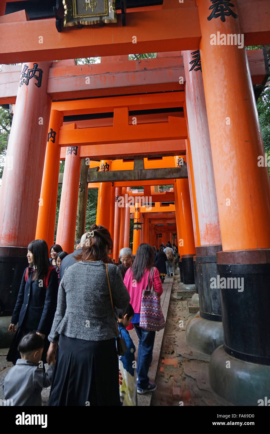 People visiting the red torii gates at Fushimi-Inari Taisha Shinto ...
