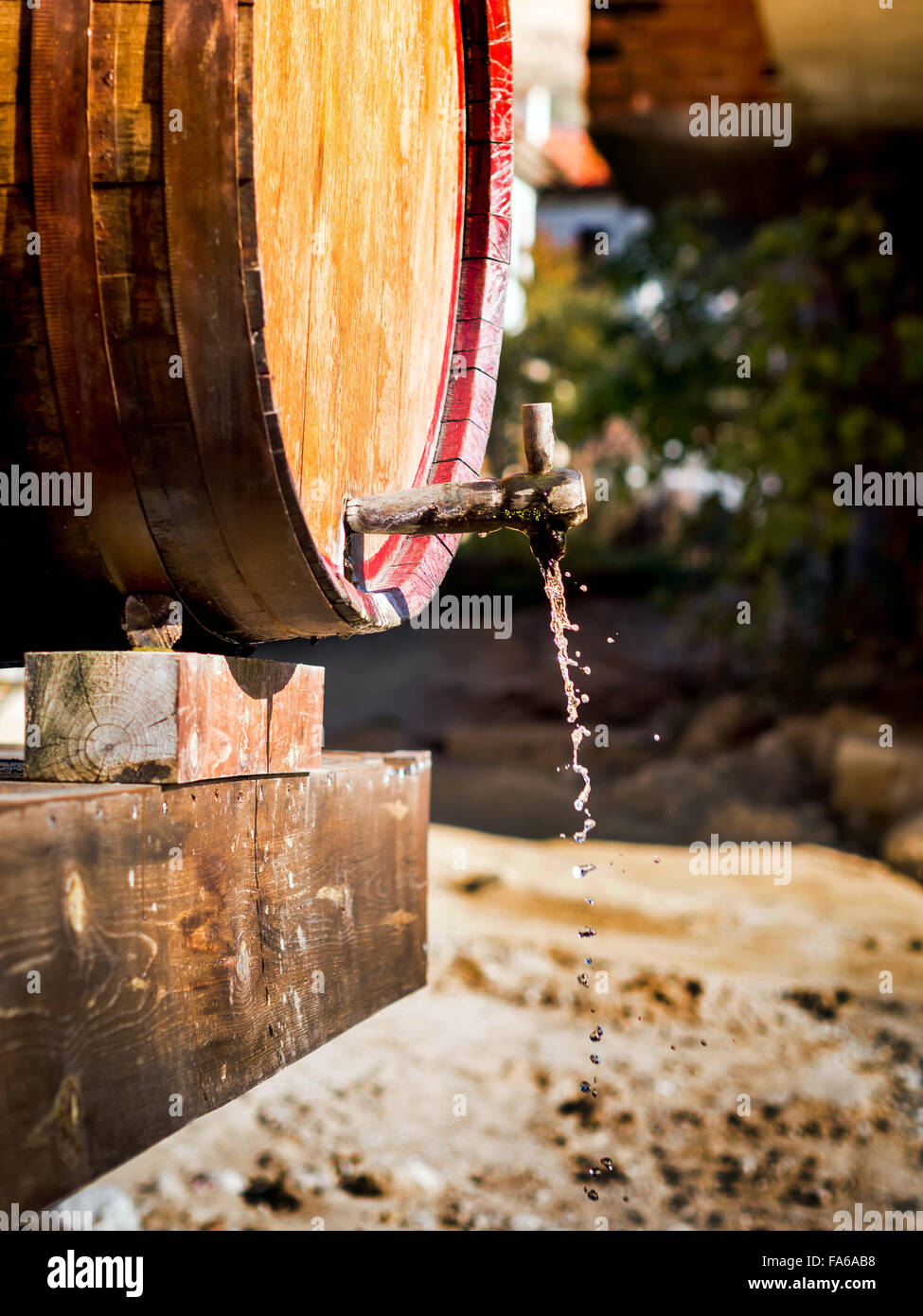 Wine dripping out of a vat Stock Photo - Alamy
