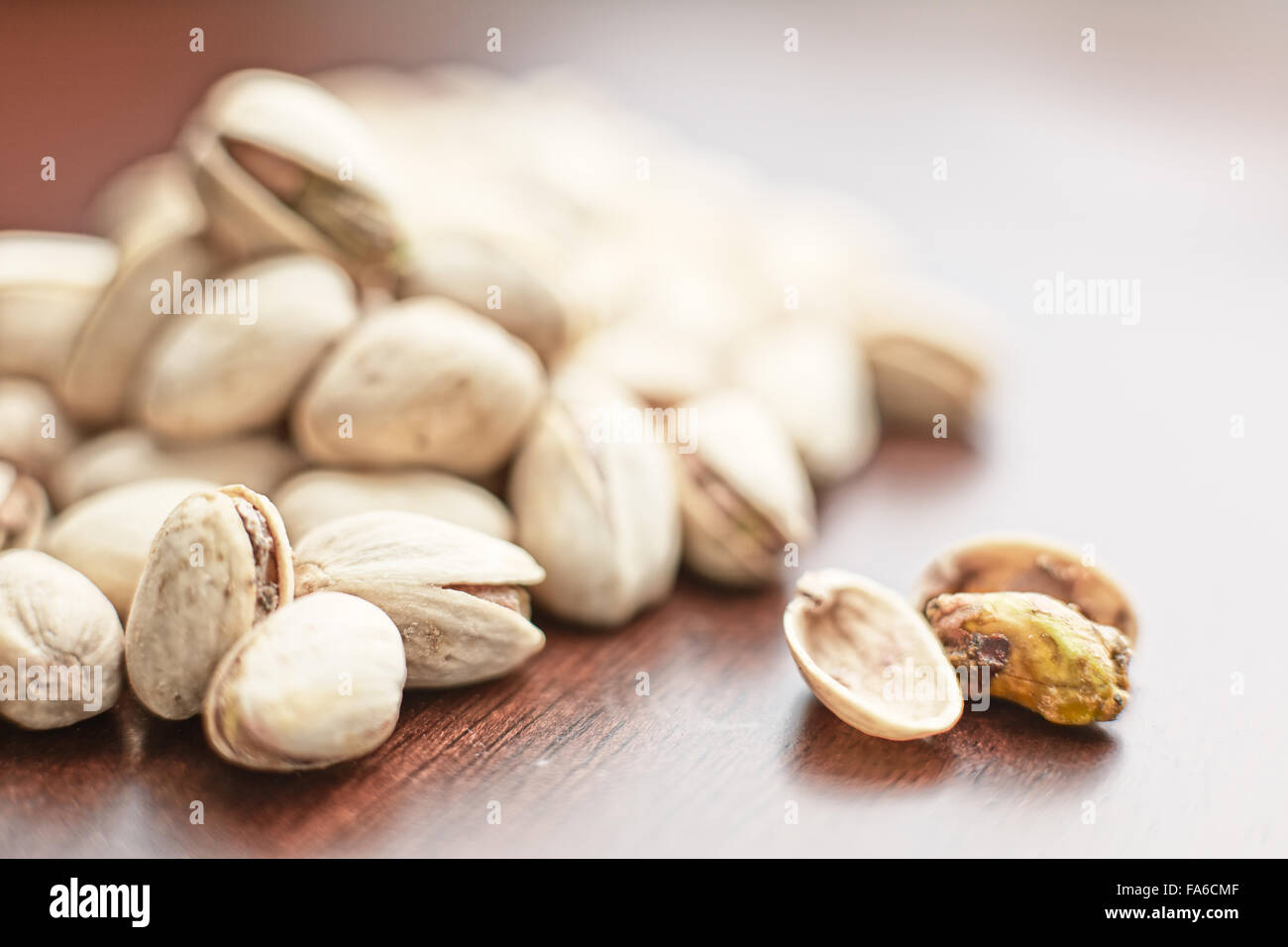 Pile of roasted, salted pistachio nuts Stock Photo - Alamy