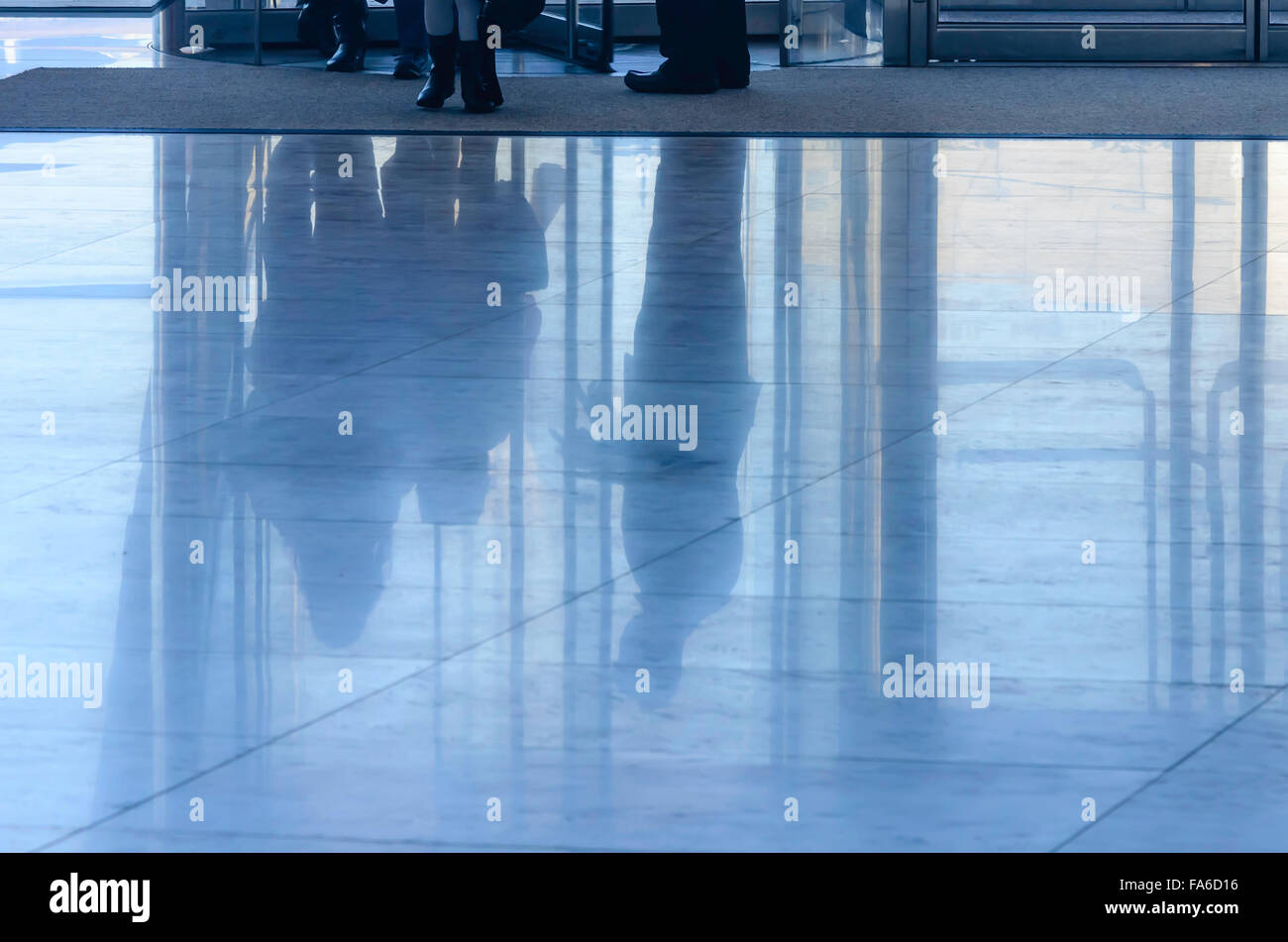 Reflections of people entering a building Stock Photo - Alamy