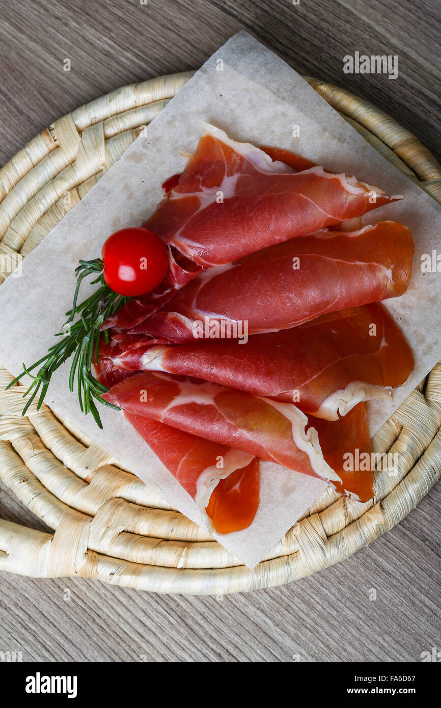 Spanish traditional snack - Jamon with tomato and rosemary Stock Photo ...