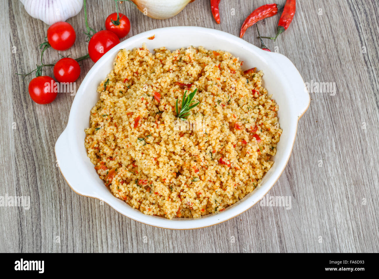 Arabic traditional cuisine - Couscous with tomato and green onion Stock ...