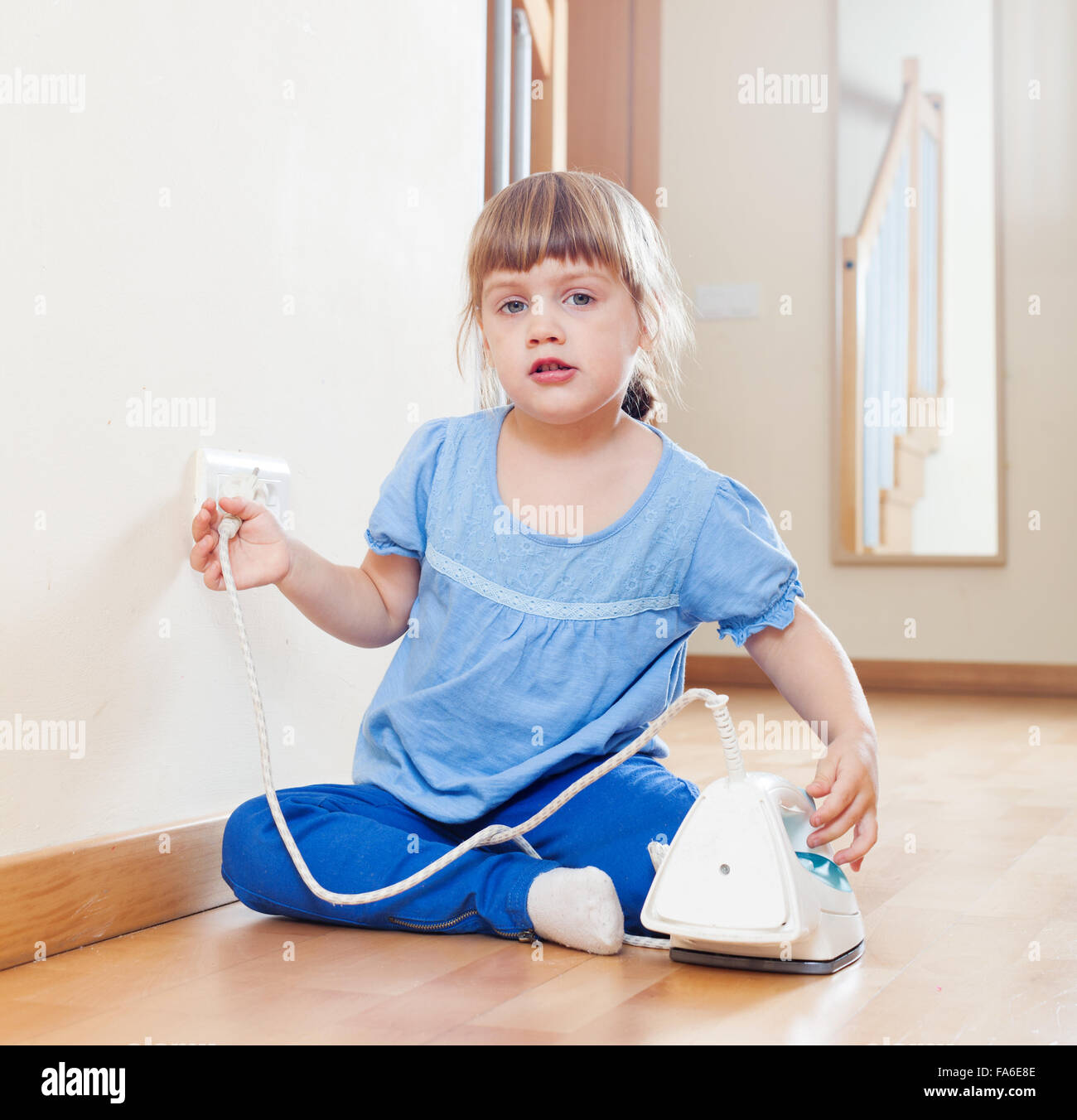 three year old child playing with electric iron Stock Photo - Alamy