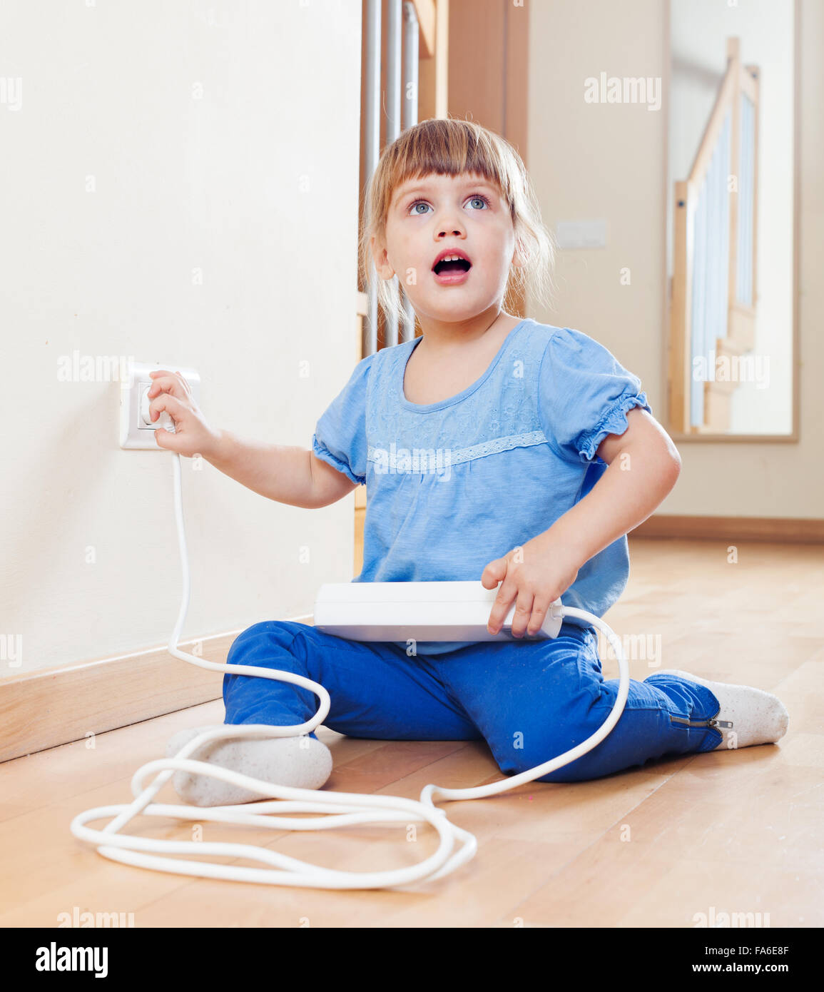 three year old child playing with electricity at home Stock Photo - Alamy