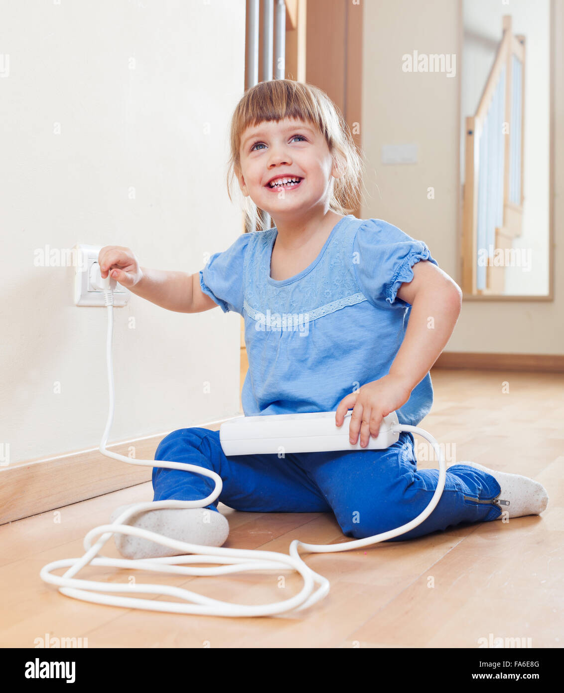 Happy three year old child playing with electricity at home Stock Photo ...