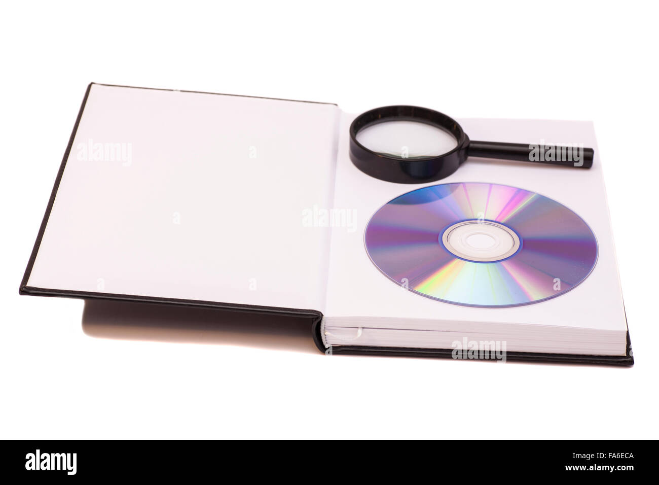 opened book with magnifying glass and compact disk CD Stock Photo - Alamy