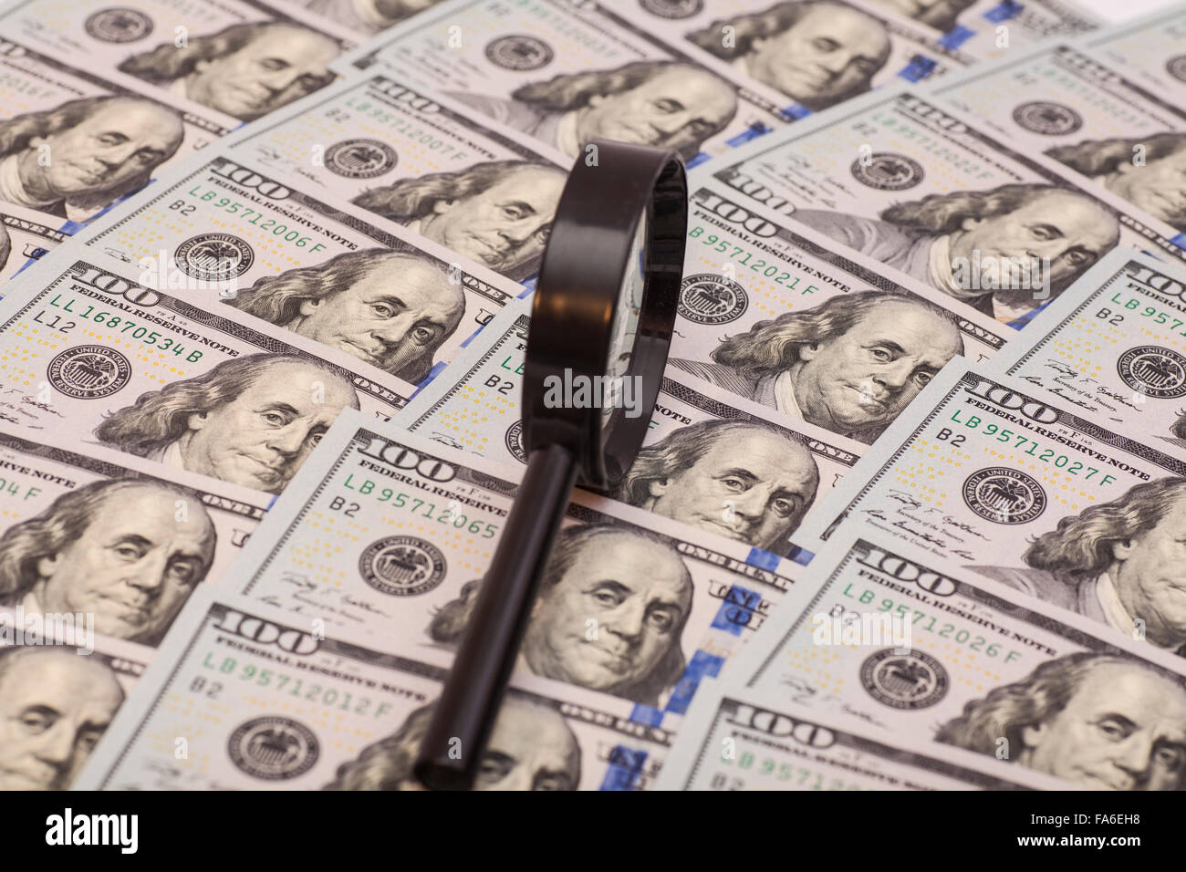 Pile dollars under magnifying glass hi-res stock photography and images ...