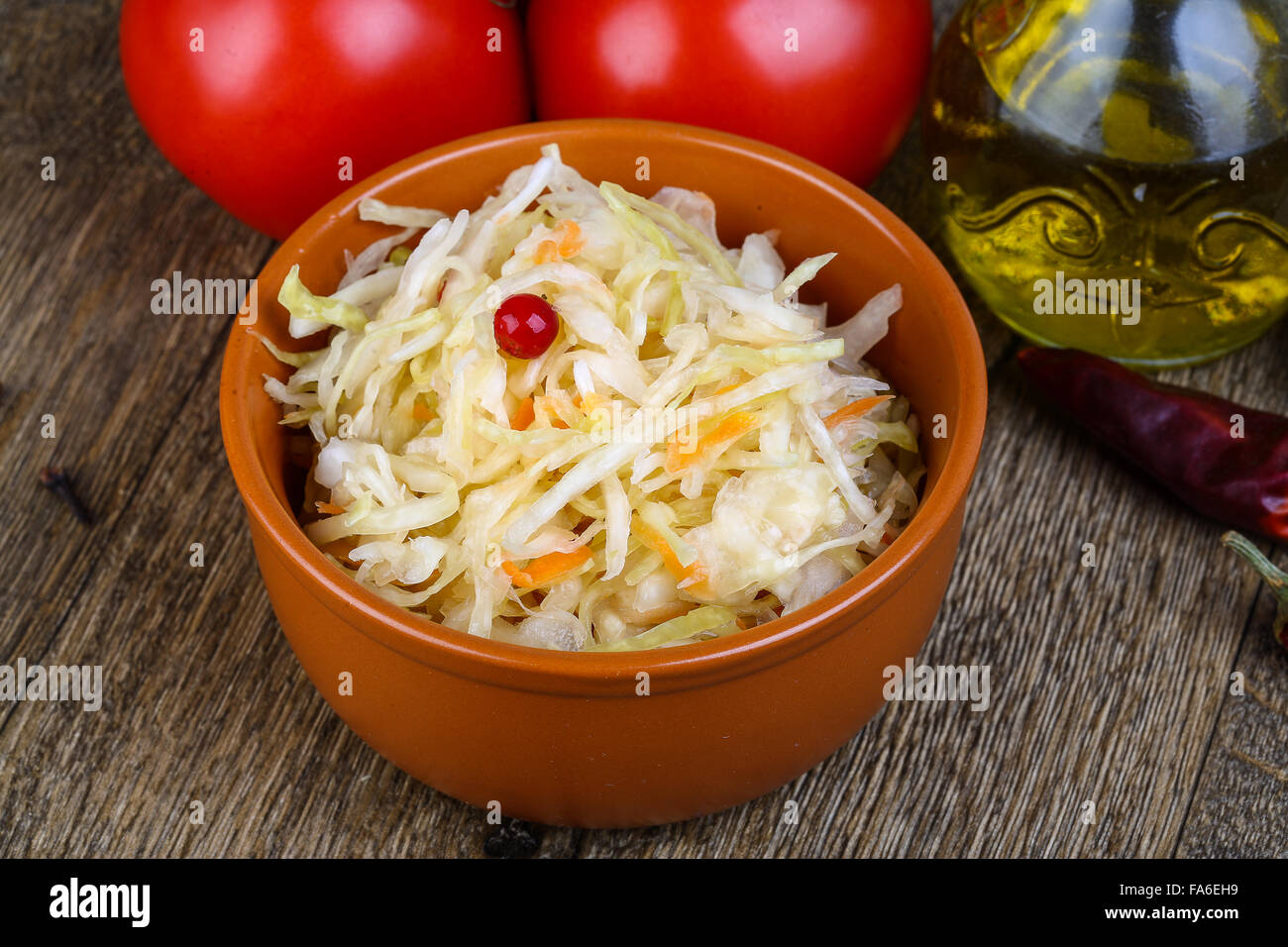 Fermented cabbage - Sauerkraut with herbs and spices on the wood ...