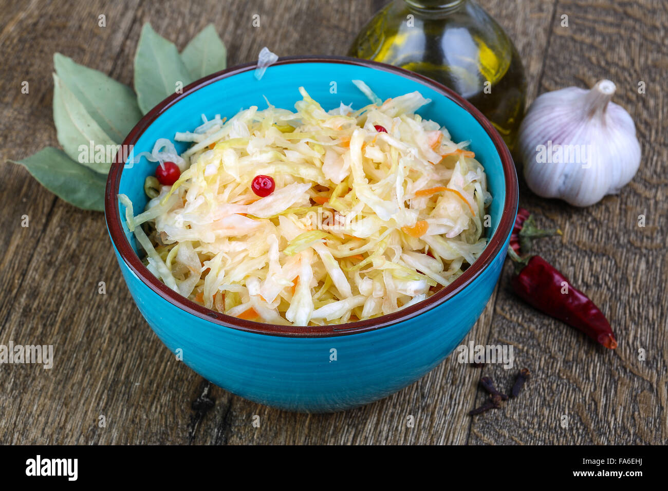 Fermented cabbage - Sauerkraut with herbs and spices on the wood ...
