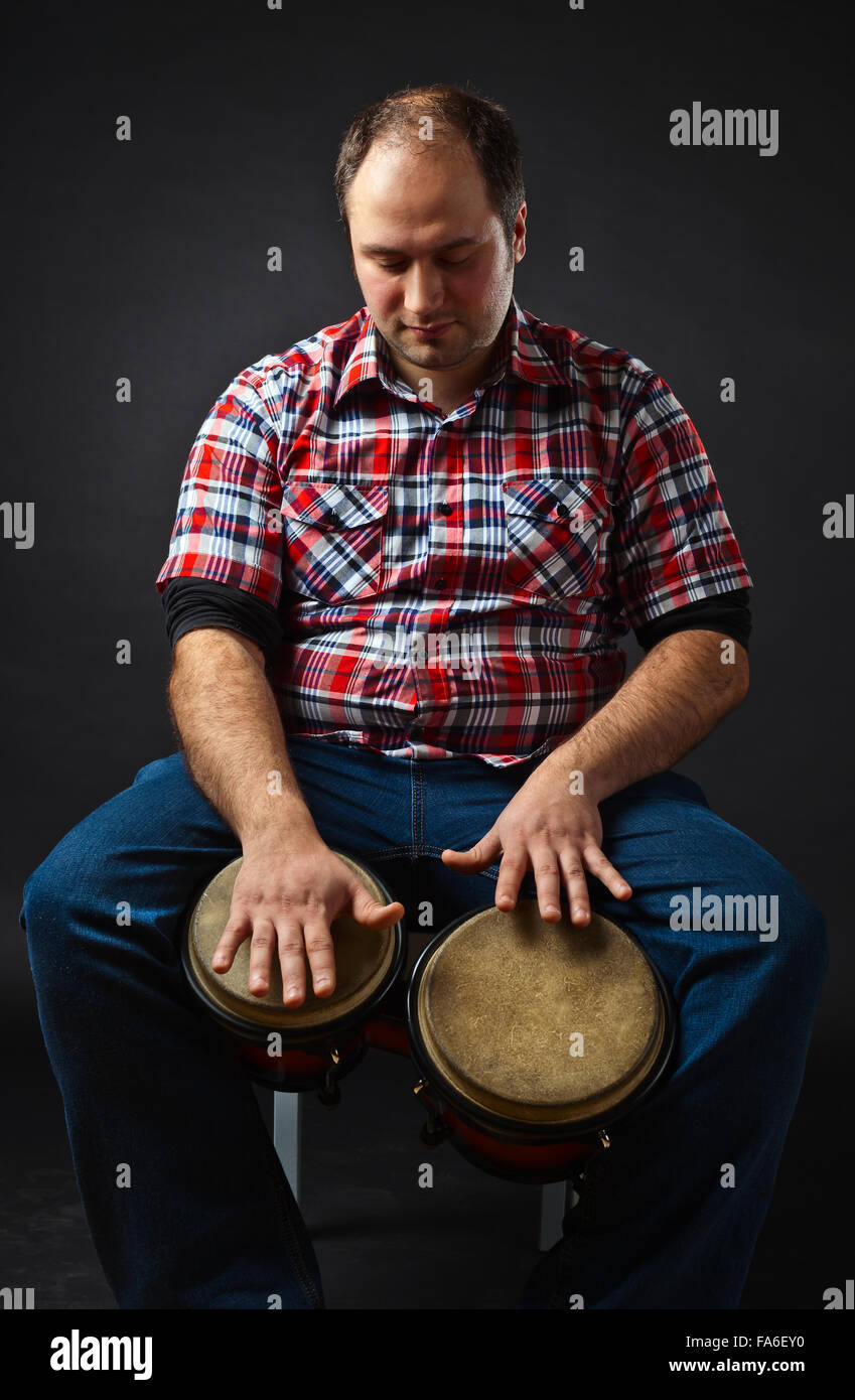 portrait of musician with bongo , studio shot Stock Photo - Alamy