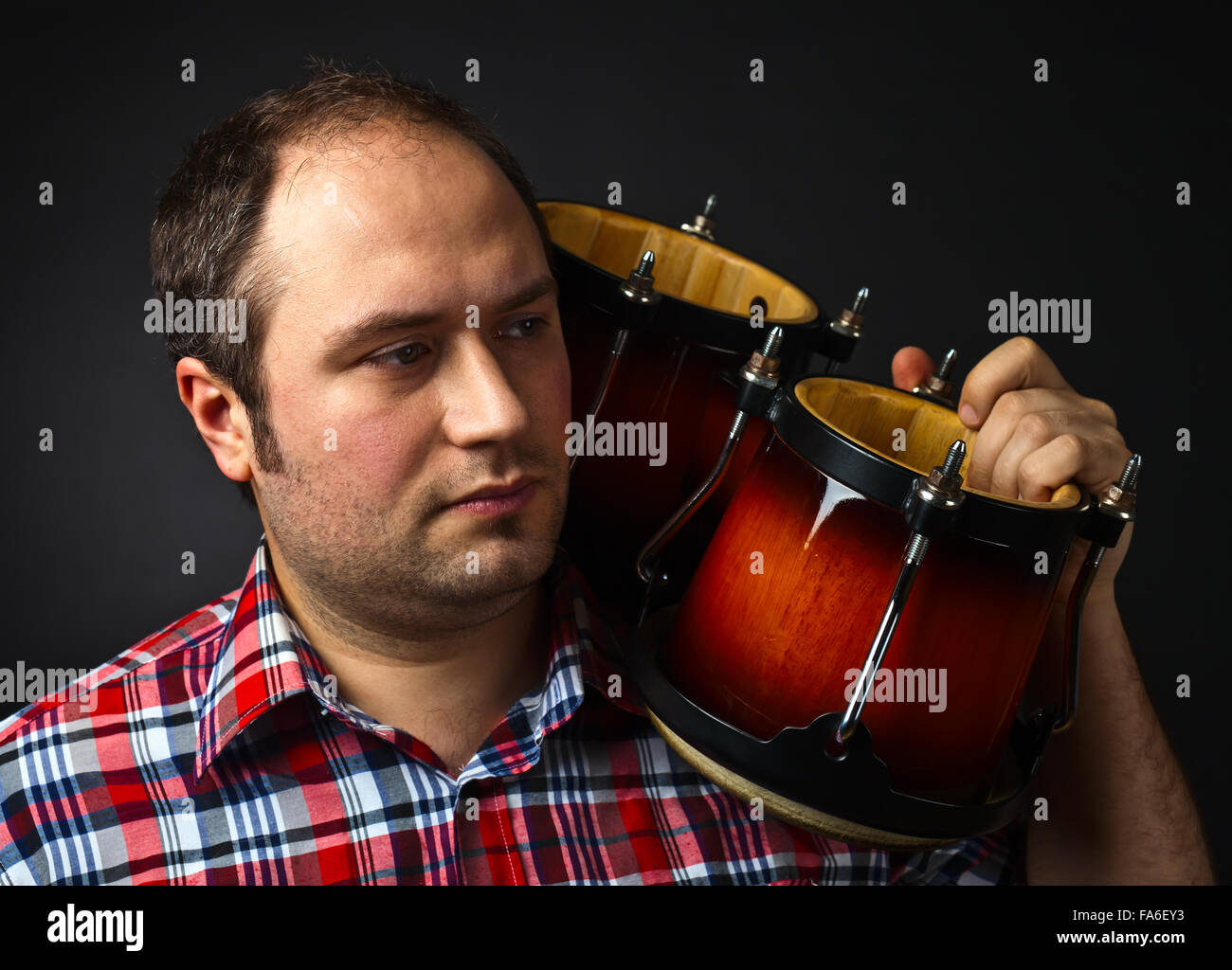 portrait of musician with bongo , studio shot Stock Photo - Alamy