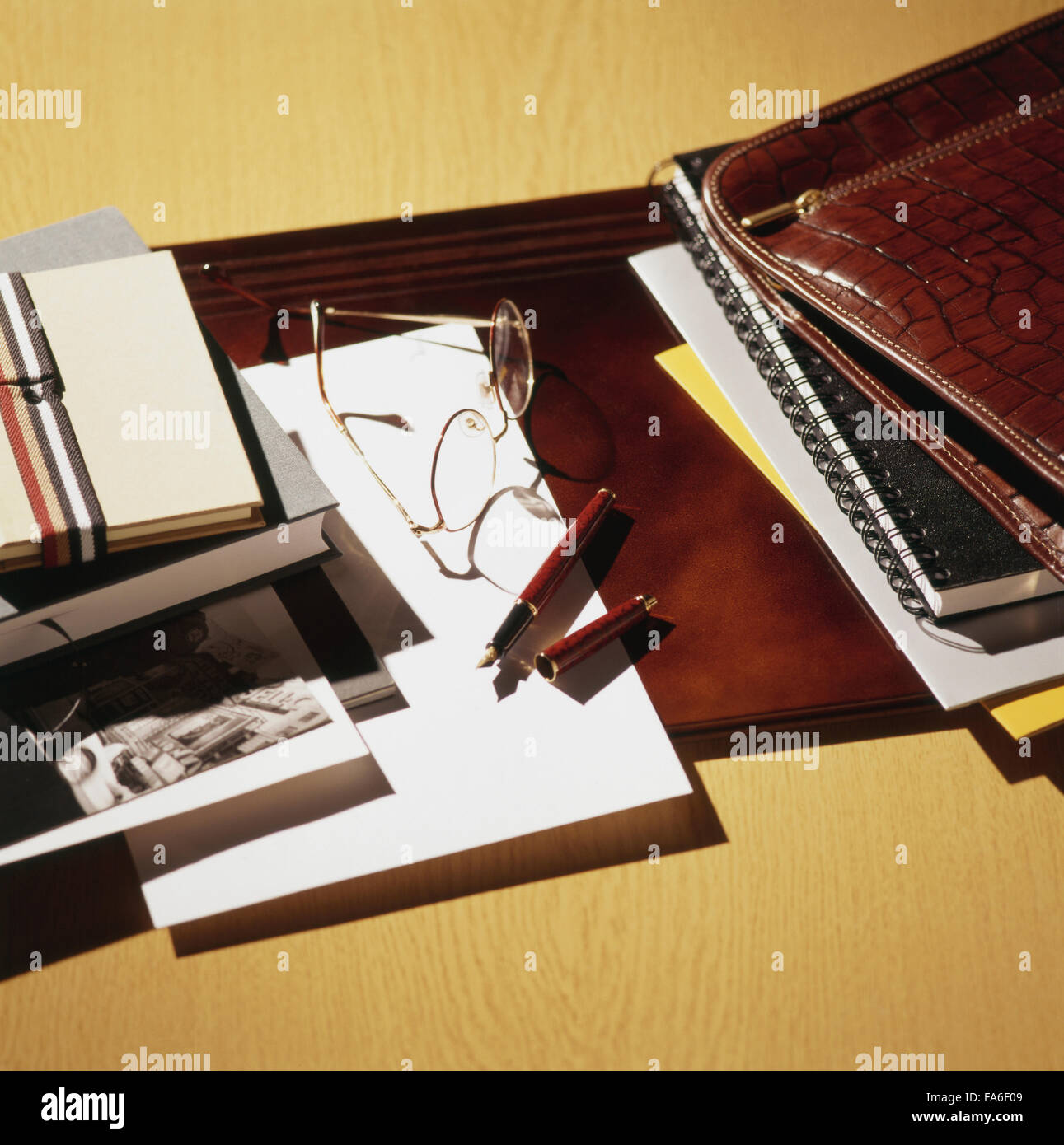 Glasses pen and paperwork business man elements still life on the desk ...