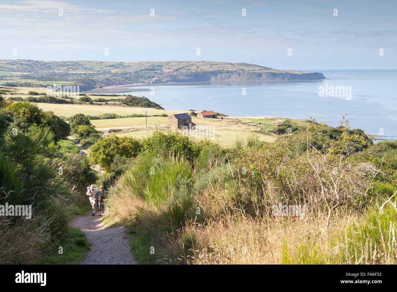 A couple walk the National Trail at Cleveland Way, Ravenscar, North ...