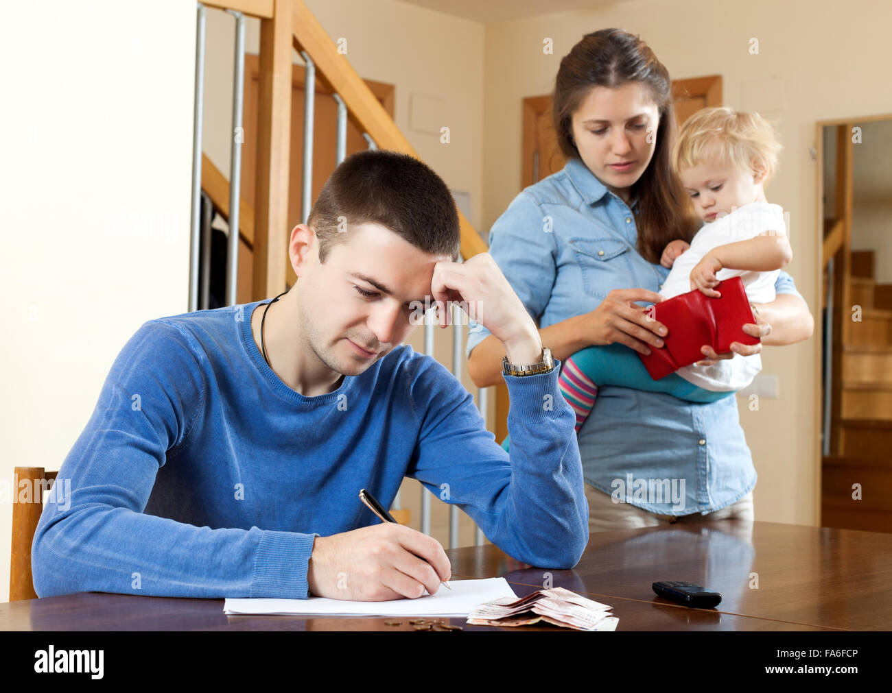 Financial problems in family of three Stock Photo - Alamy