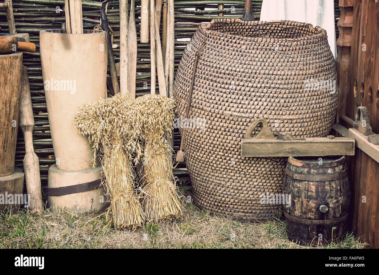 Near ancient objects of rural life two bundle of stalks of grain crops ...