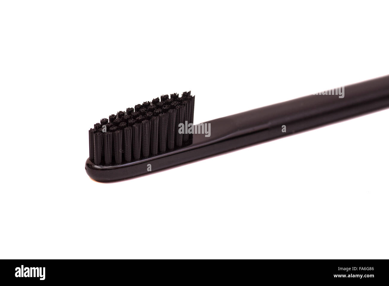Black toothbrush isolated on white background Stock Photo - Alamy
