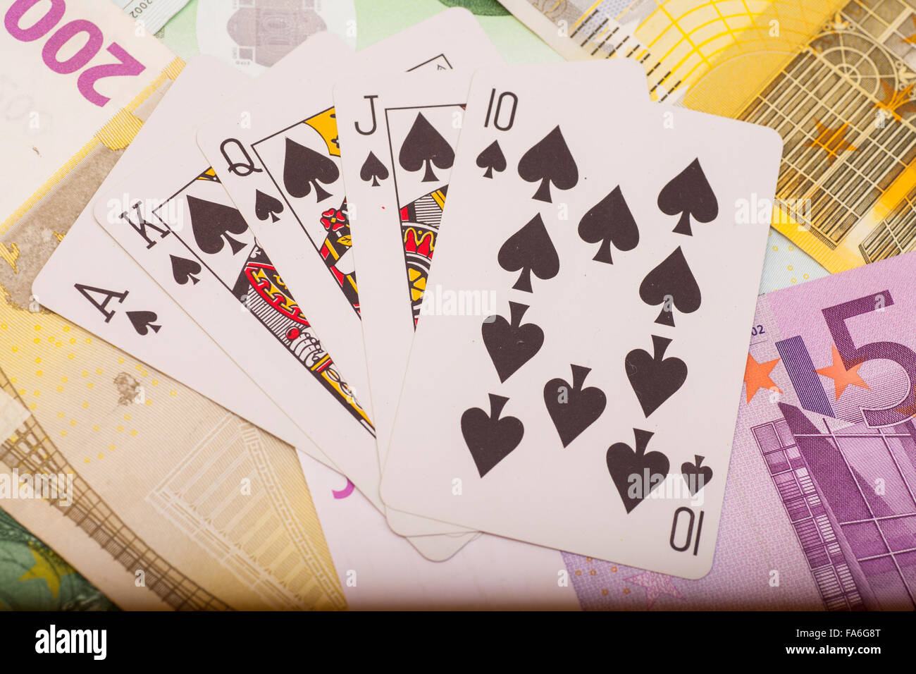 Playing cards and euros Stock Photo - Alamy