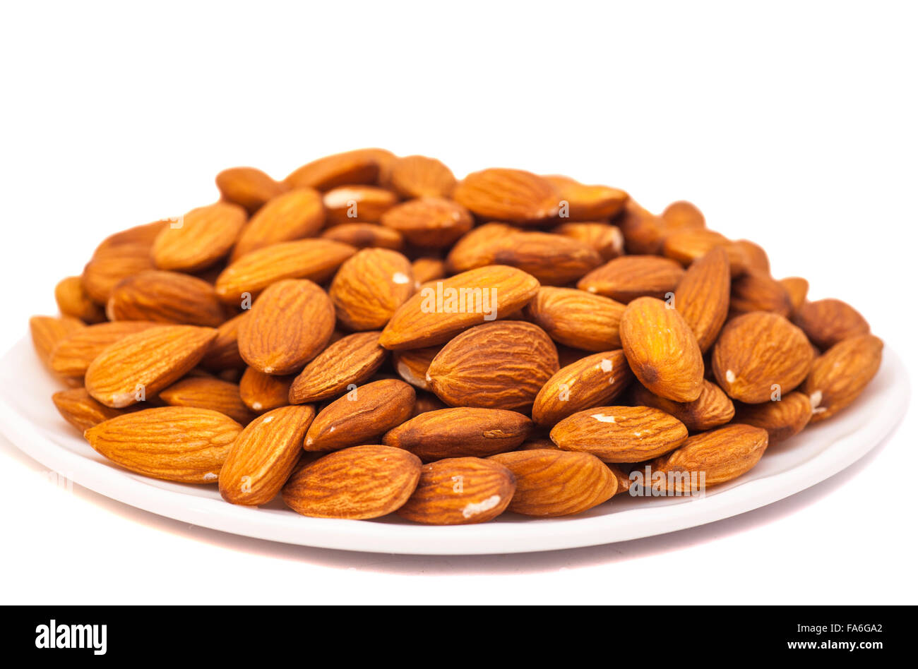 Pile of almonds in white bowl isolated over white background Stock ...