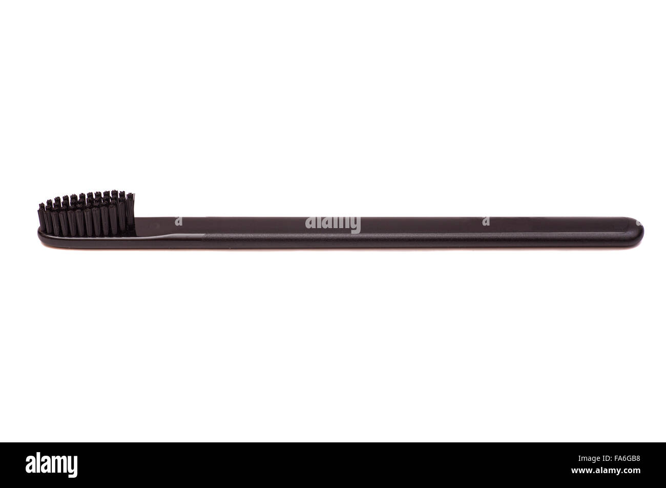 Black toothbrush isolated on white background Stock Photo - Alamy