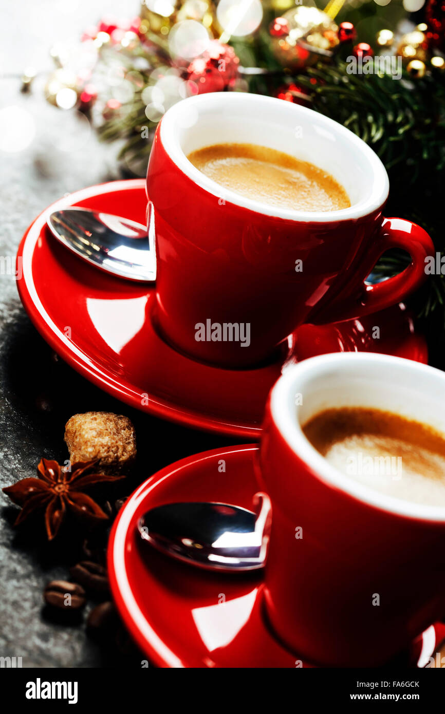 Coffee Espresso. Red Cups Of Coffee and Christmas decorations on dark ...