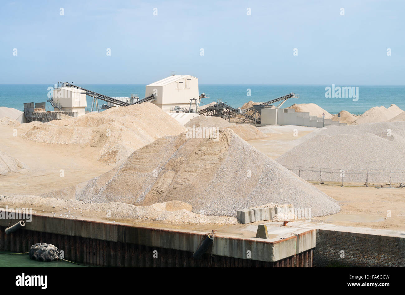 Piles of marine aggregates at Dieppe harbour, Seine-Maritime, Normandy ...