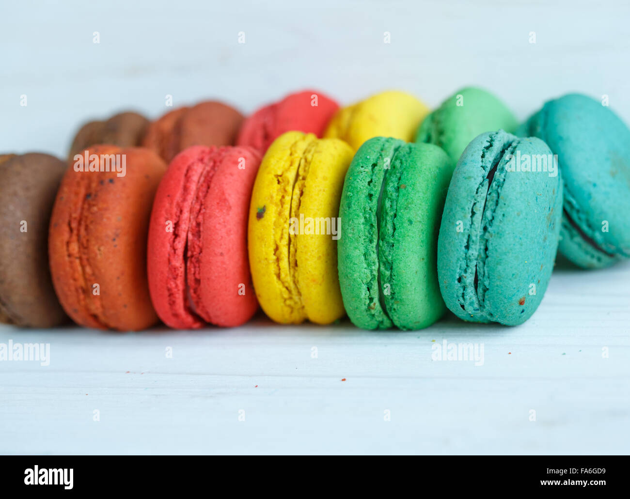 Colourful tasty macaroons in a row. A french sweet delicacy Stock Photo ...