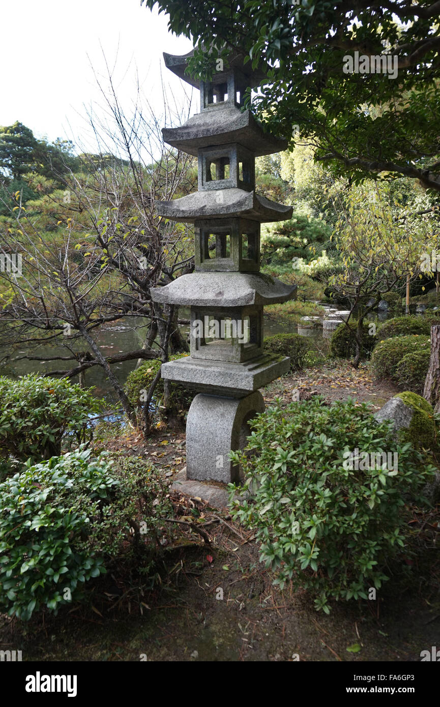 A stone pagoda in the garden at Heian-jingu, Kyoto, Japan Stock Photo ...