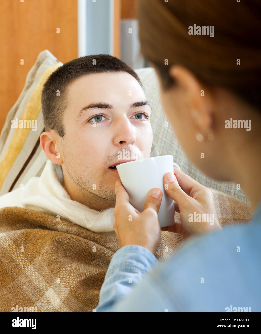 woman caring for sick man at home Stock Photo - Alamy