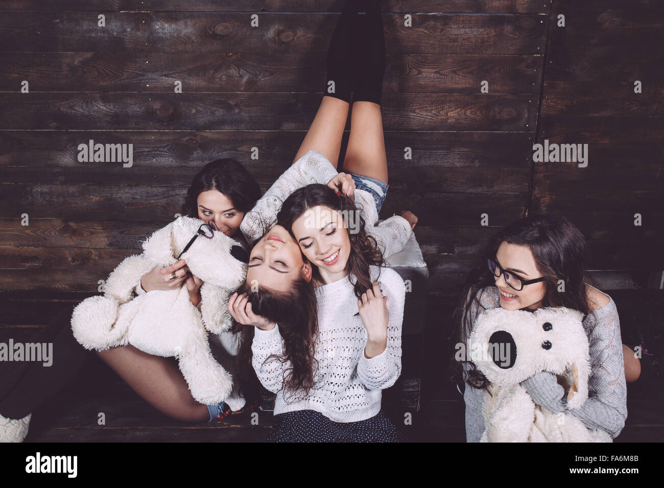 Four charming model posing Stock Photo - Alamy