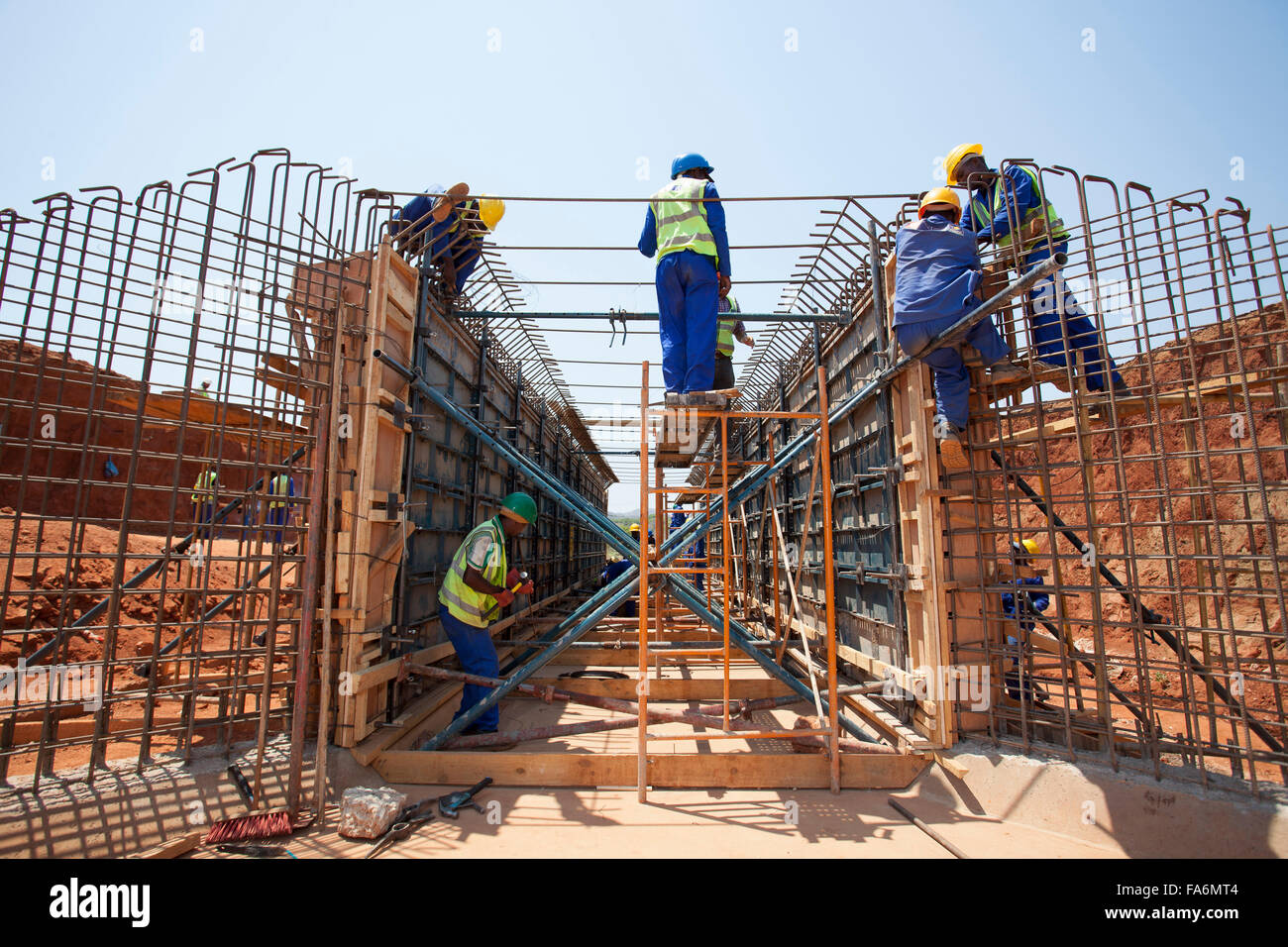 Workers construct a culvert along the Nampula to Rio Ligonha Road in ...