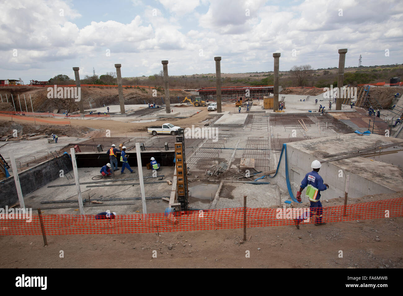 Workers rehabilitate the aging Nacala Dam in Nampula Province ...