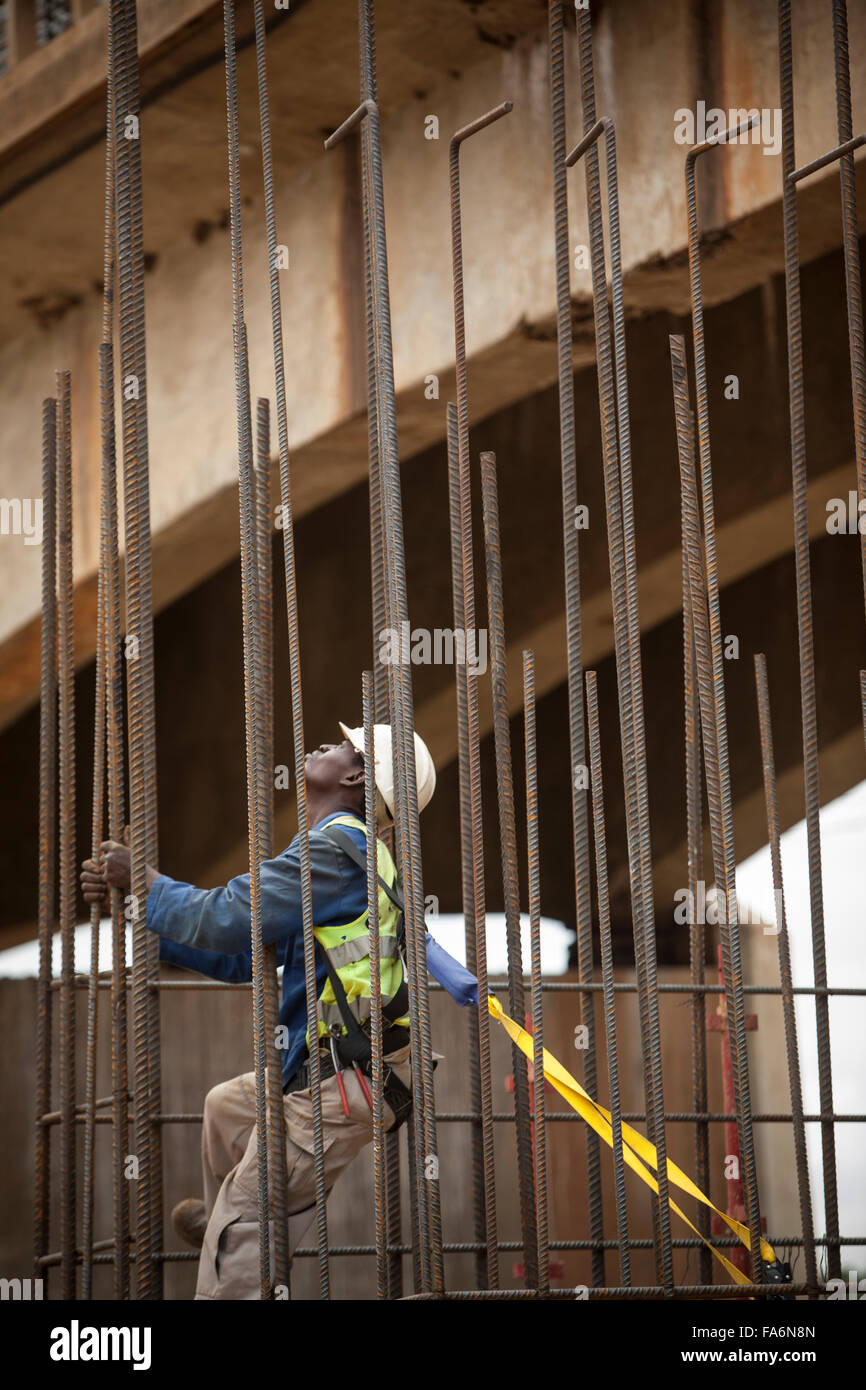 Construction workers rehabilitate an aging bridge along the Namialo to ...