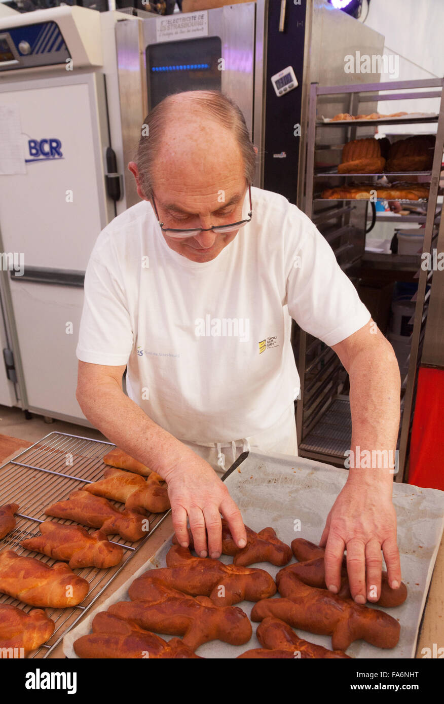 A french baker making bread at christmas, Strasbourg France Europe ...