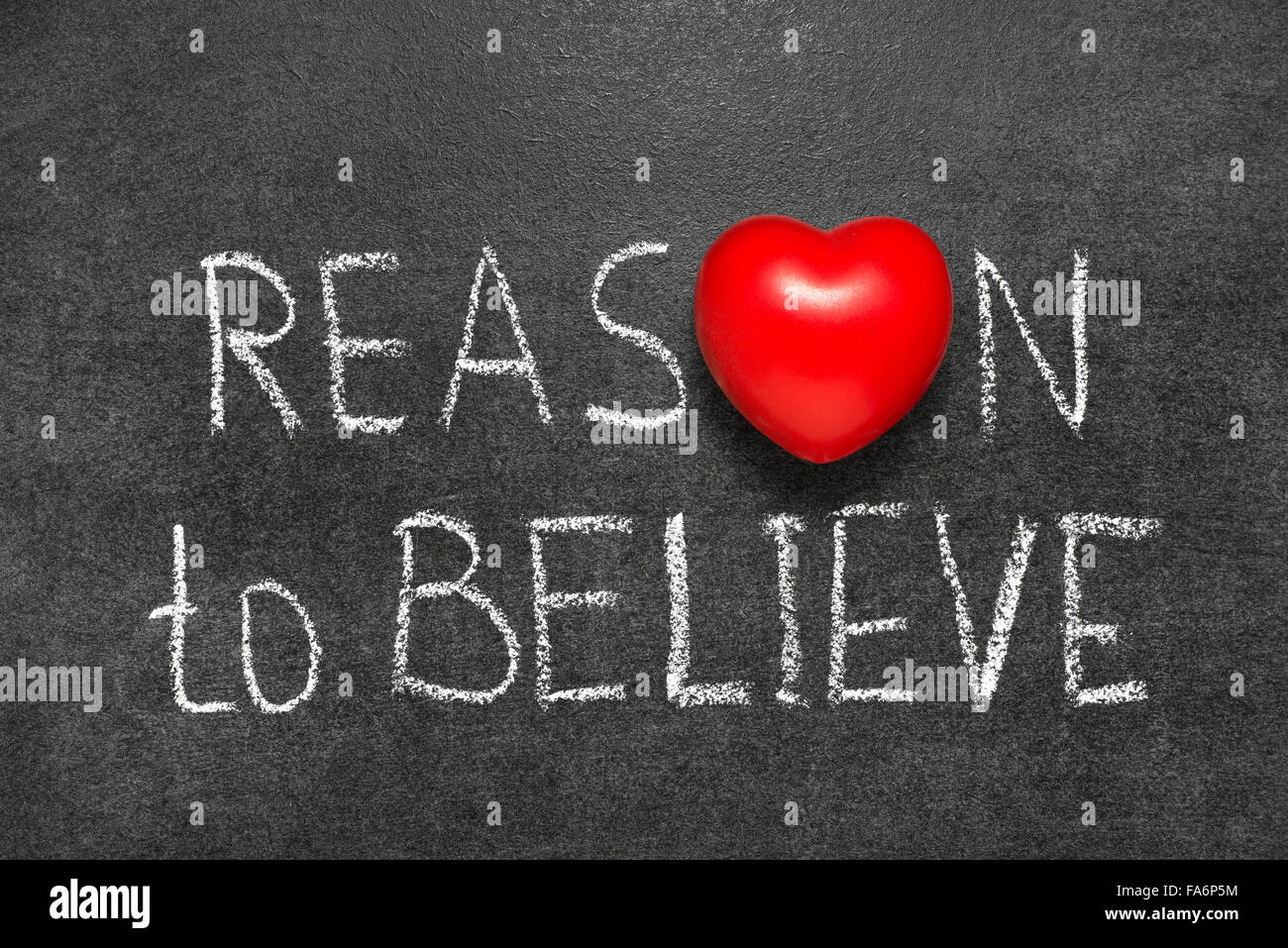 reason to believe phrase handwritten on blackboard with heart symbol ...
