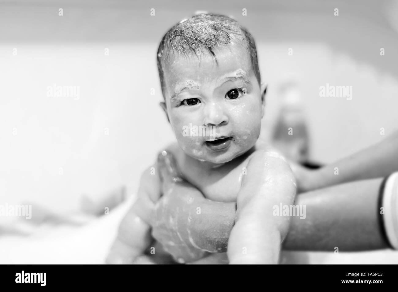 cute Baby girl washing in bathroom black&white Stock Photo - Alamy