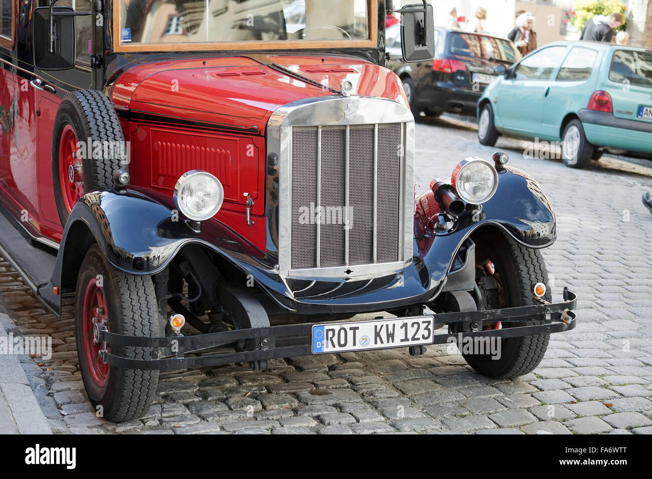 Old fashioned red bus in Rothenburg Stock Photo - Alamy