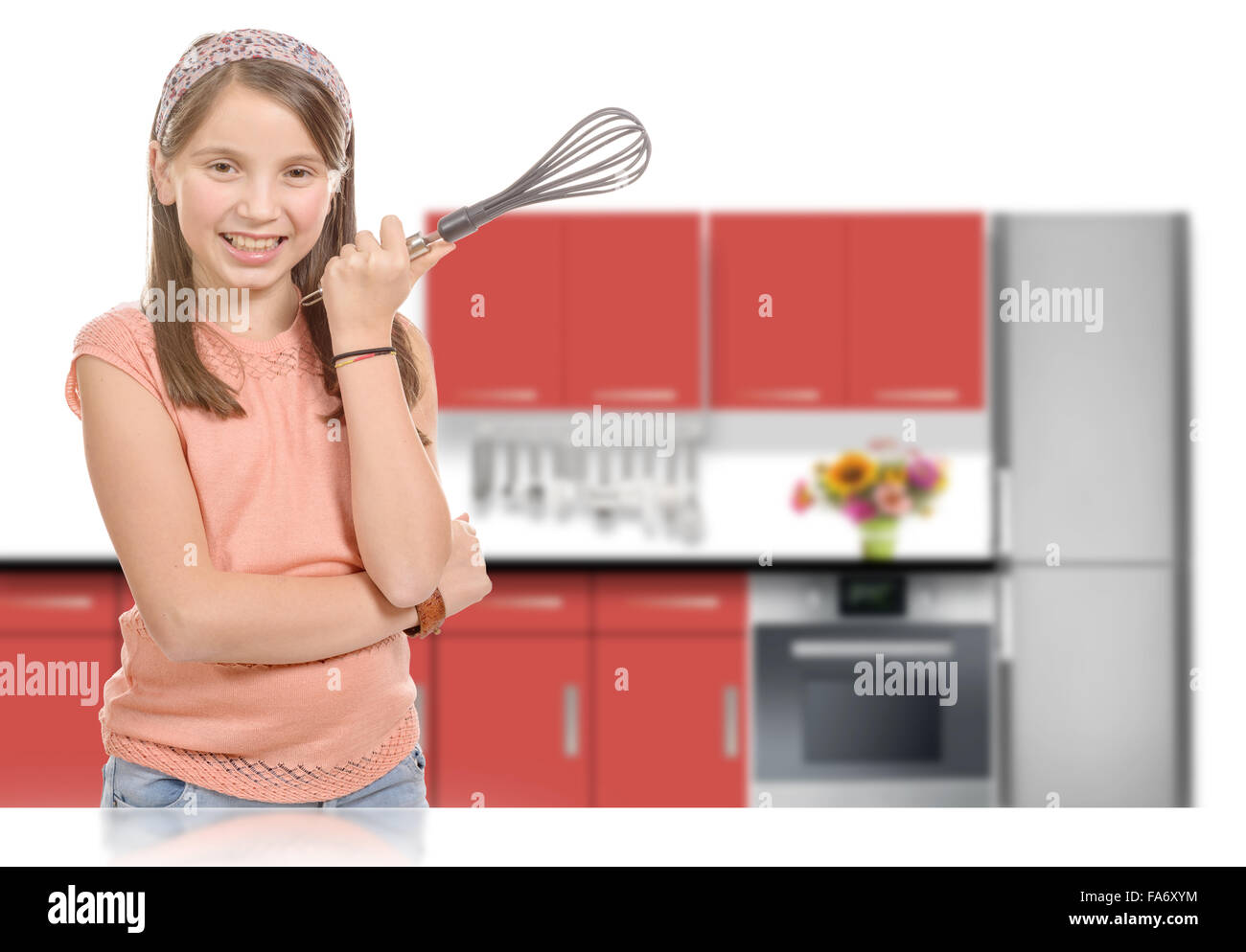 a smiling young girl in a kitchen Stock Photo - Alamy
