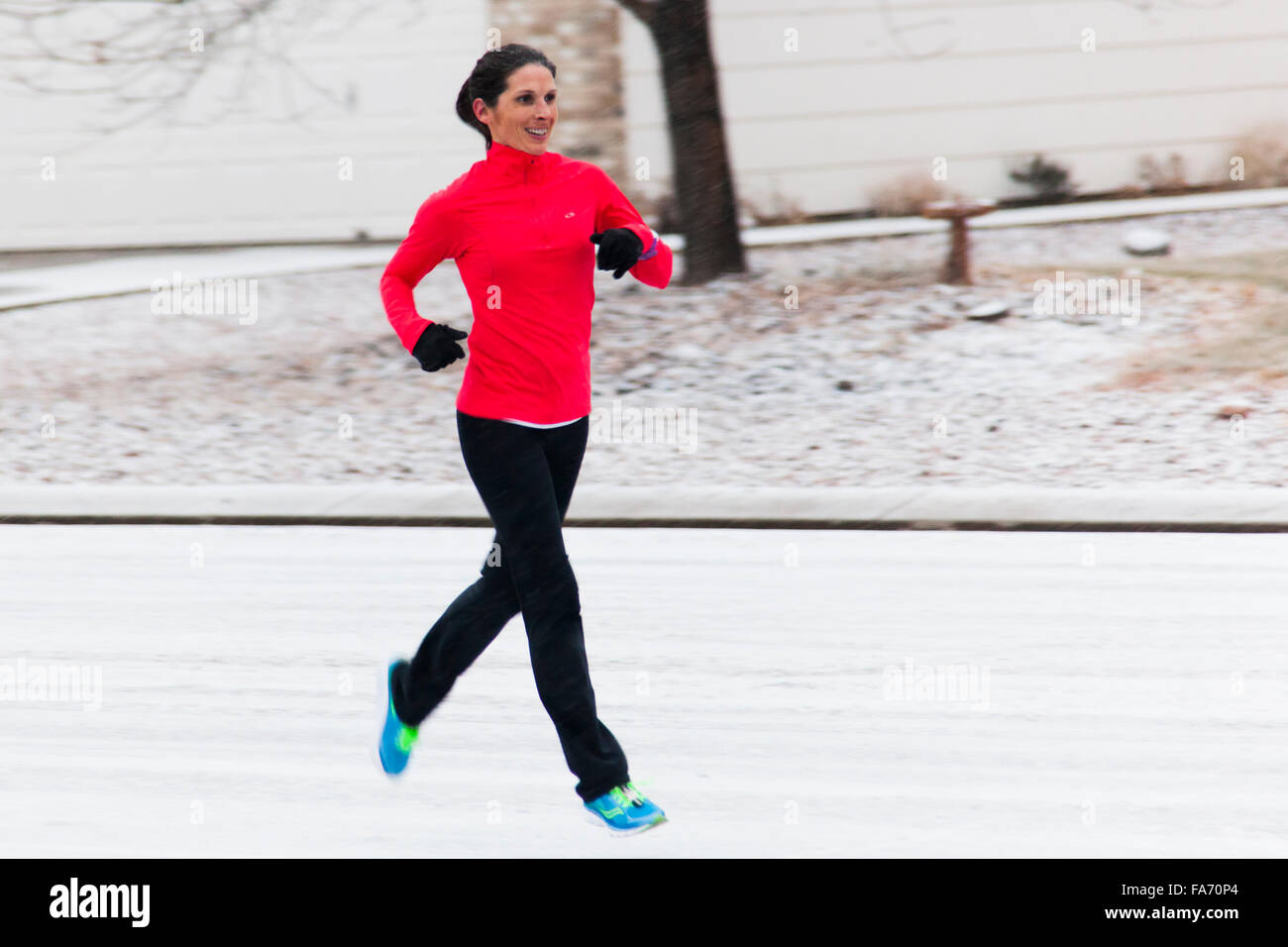 Woman running feet off ground hi-res stock photography and images - Alamy
