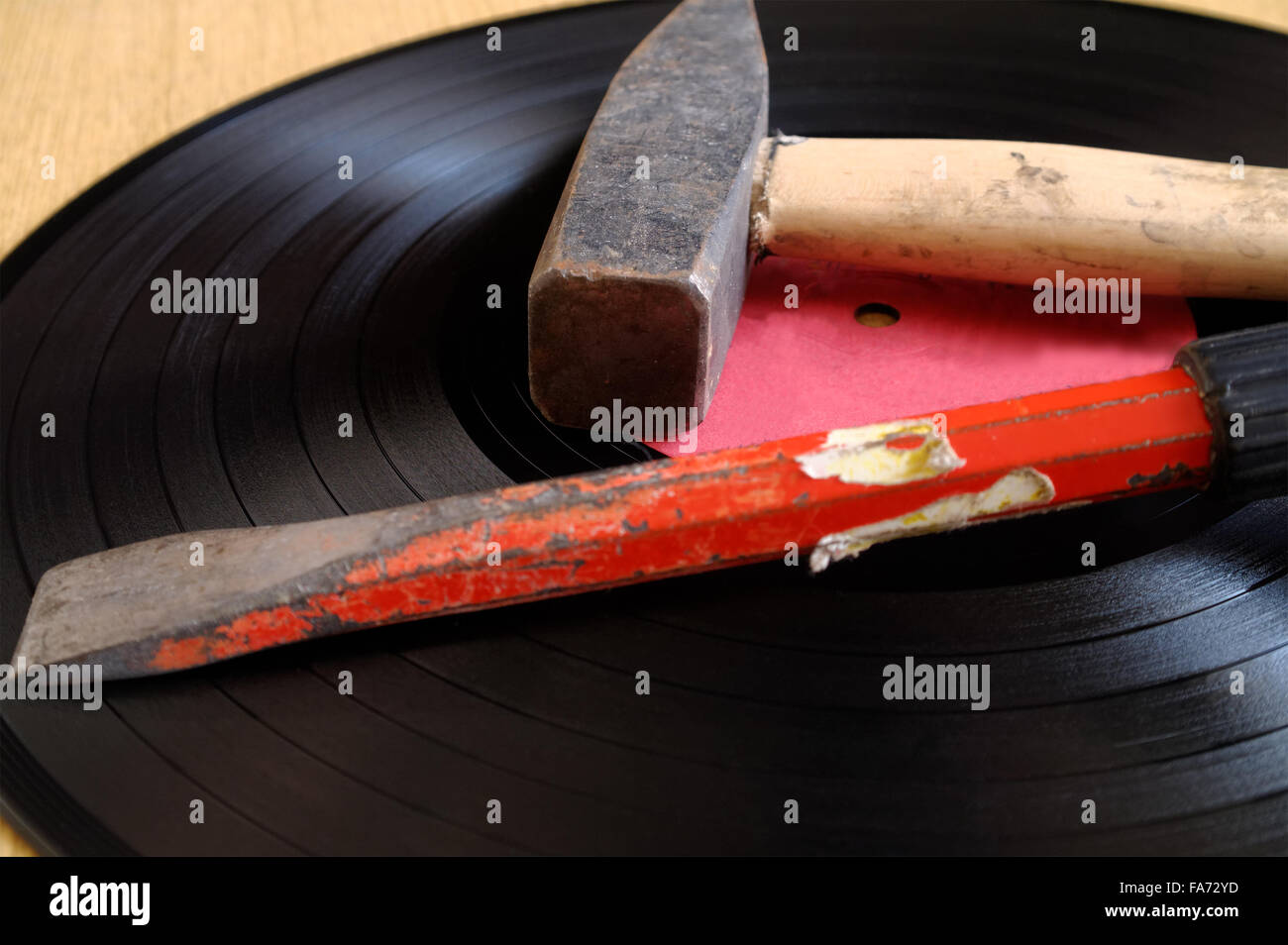 old vinyl and tools for repair its Stock Photo - Alamy
